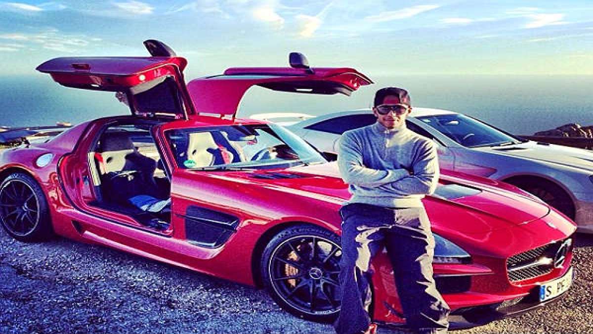 Lewis Hamilton Poses With His Mercedes-Benz sports cars - DriveSpark
