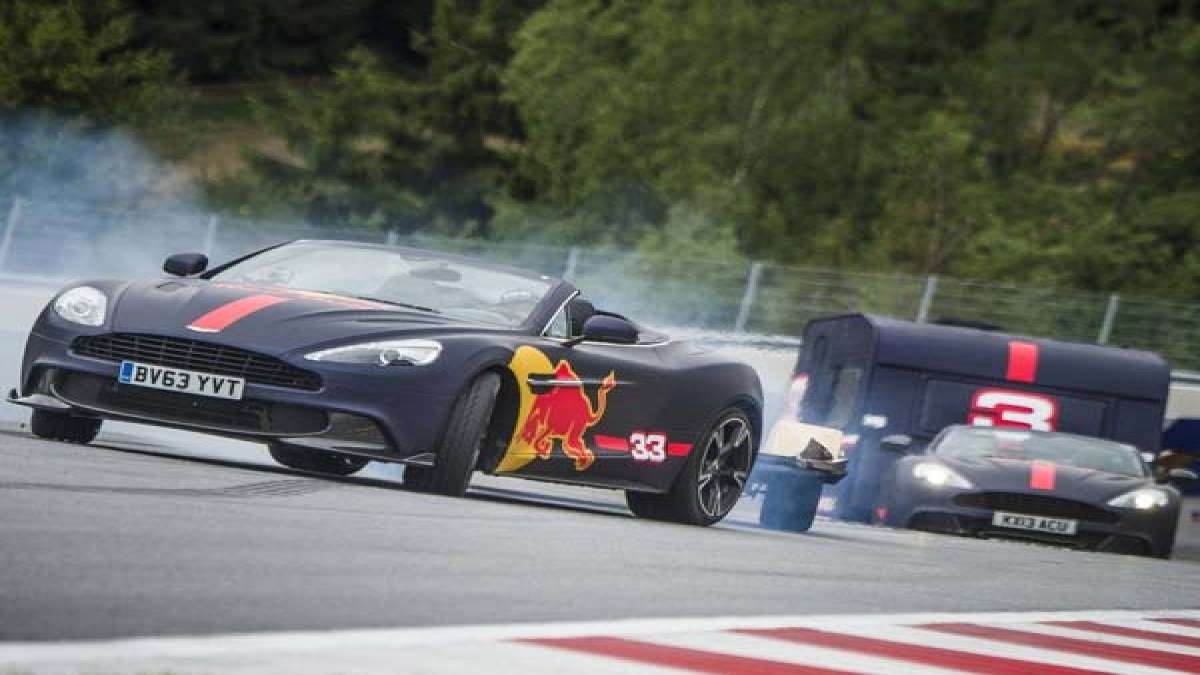 Red Bull Formula One Drivers Race Aston Martin Towing Campers ...