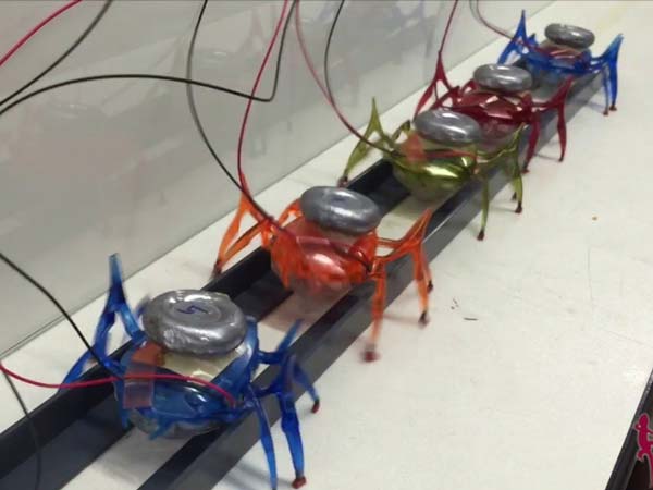 Video: Tiny Robots Move Two Ton car - DriveSpark