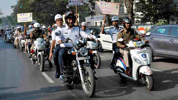 Traffic Cop Fines Son For Riding Motorcycle Without Helmet - DriveSpark ...