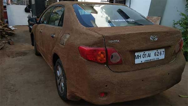 Toyota Corolla Owner Gets Car Wrapped In Cow Dung - DriveSpark News